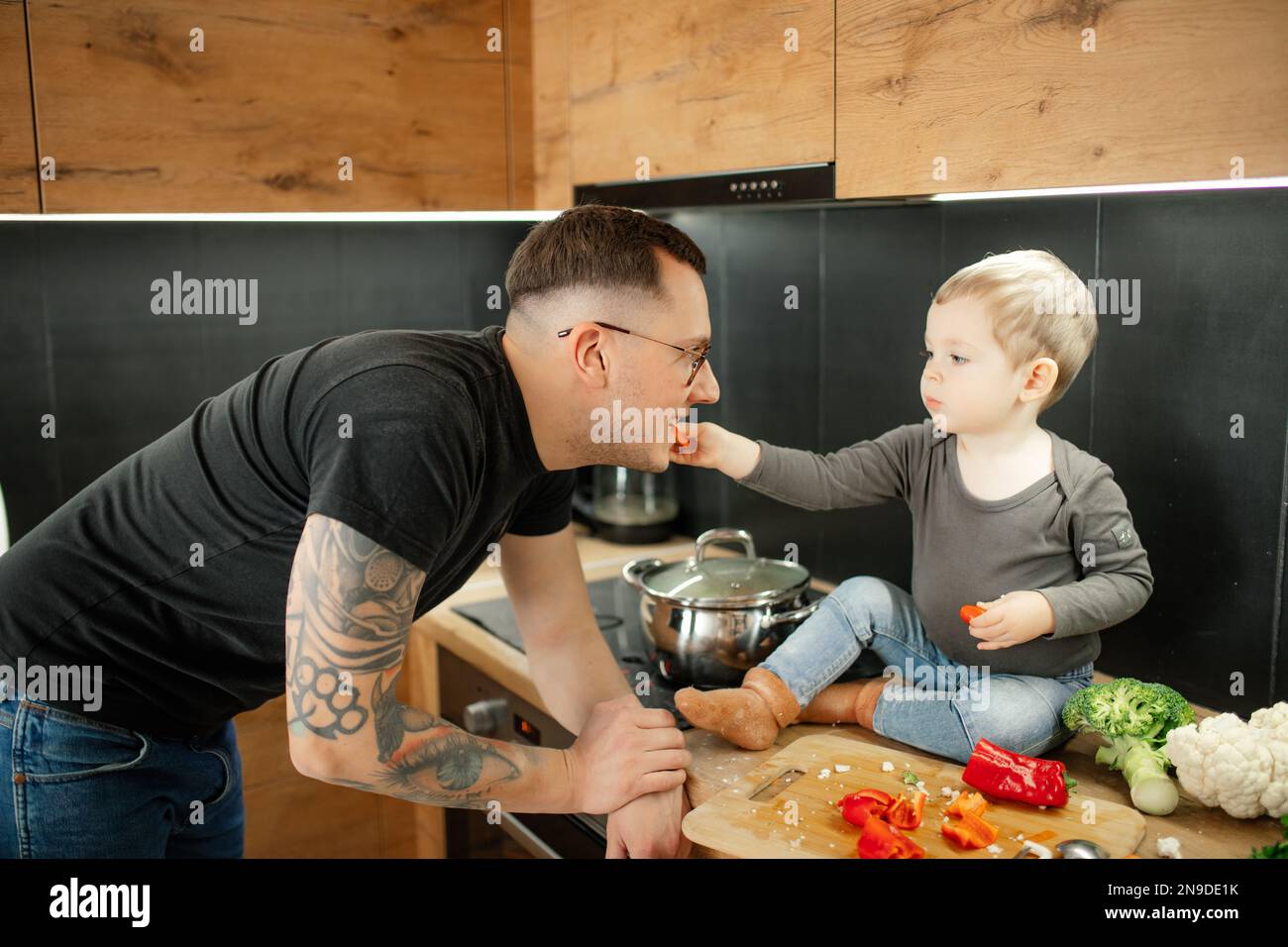 Help father cook hi-res stock photography and images - Alamy