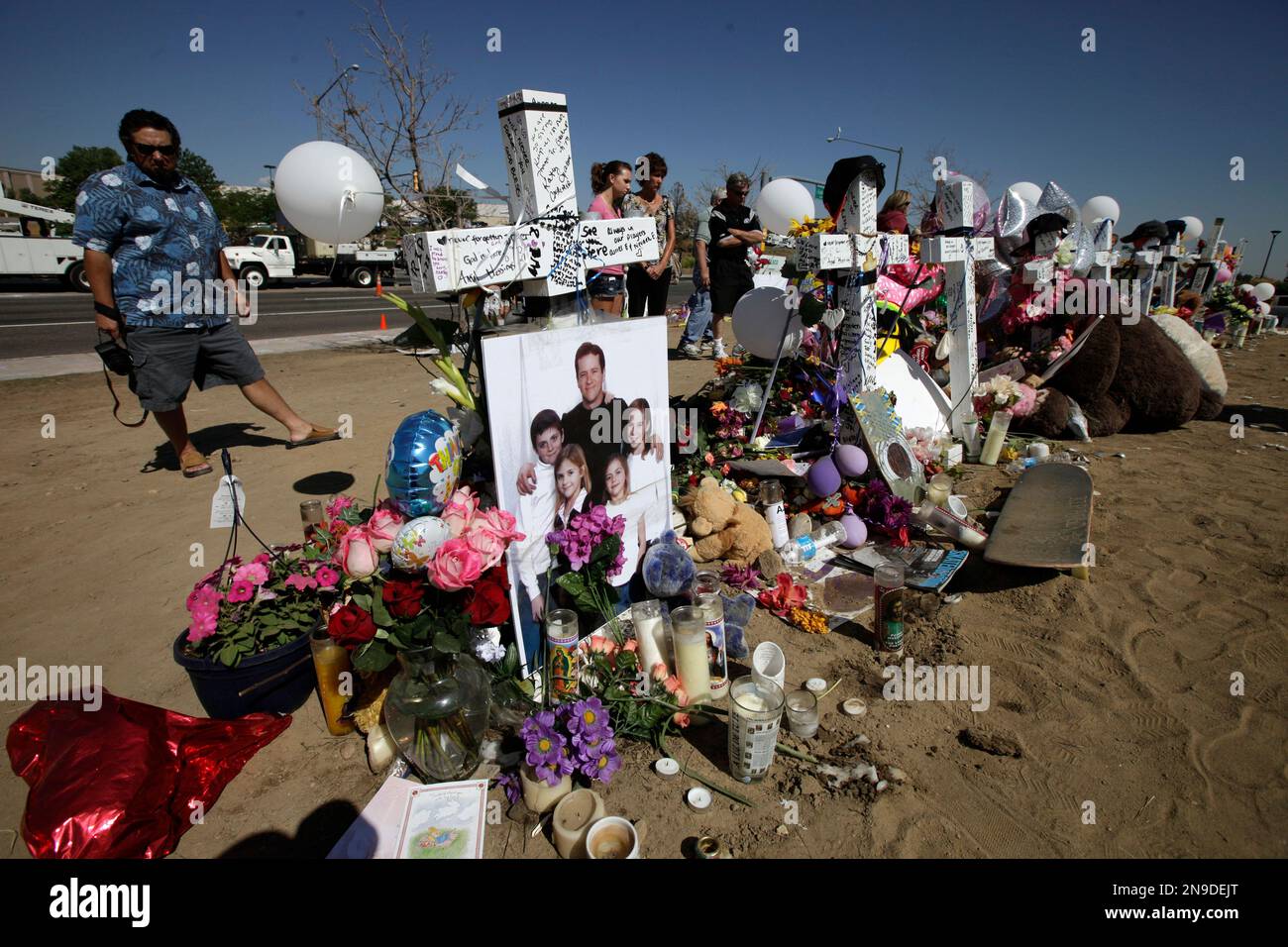 Crosses dedicated to Gordon Cowden, left, and other victims of last ...