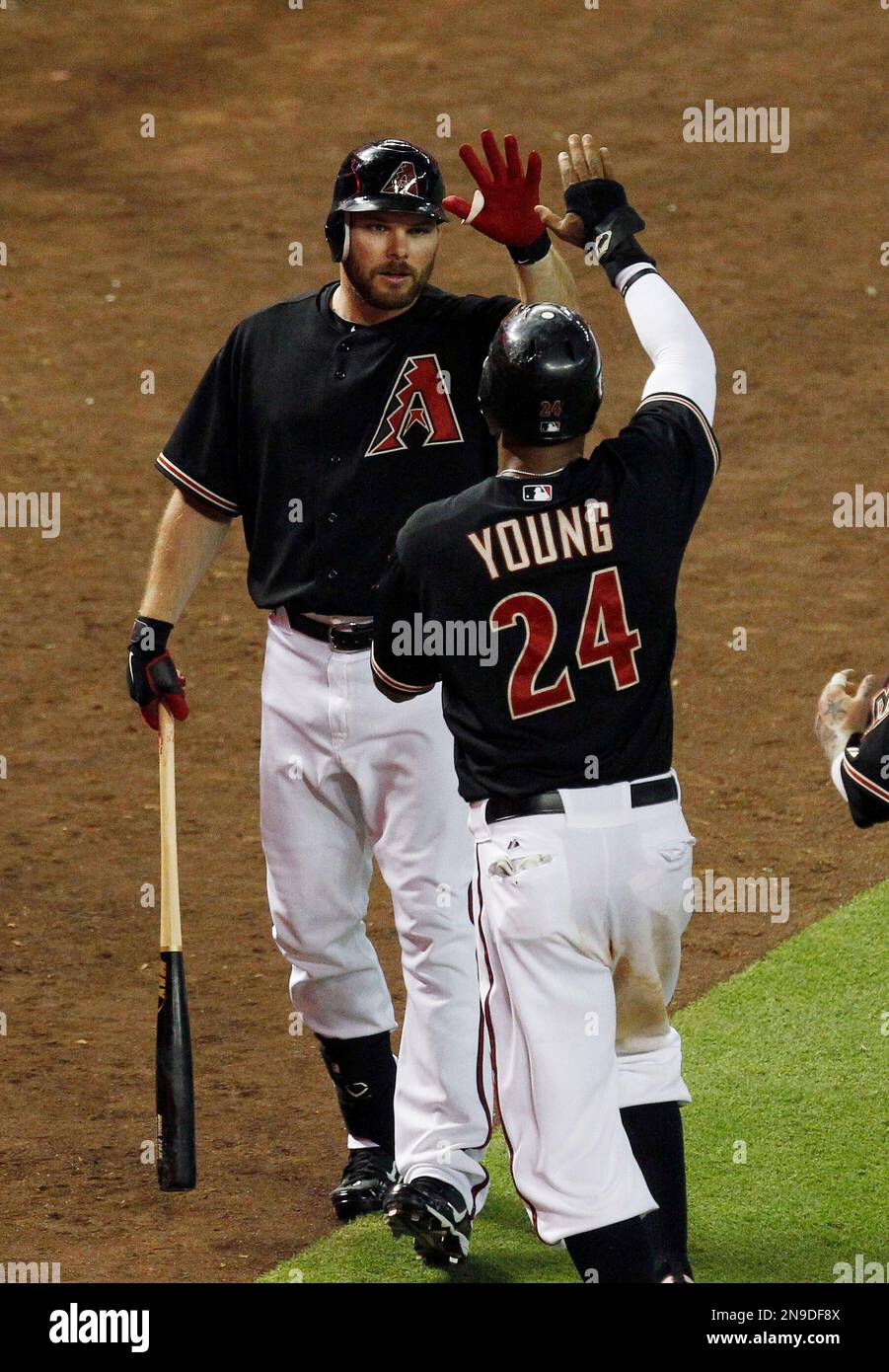 Arizona Diamondbacks' Jason Kubel, left, gives a high-five to teammate ...