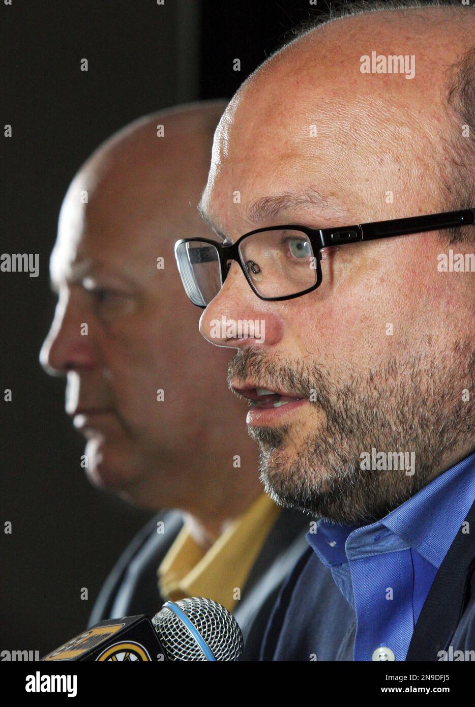 Boston Bruins general manager Peter Chiarelli, foreground, speaks ...