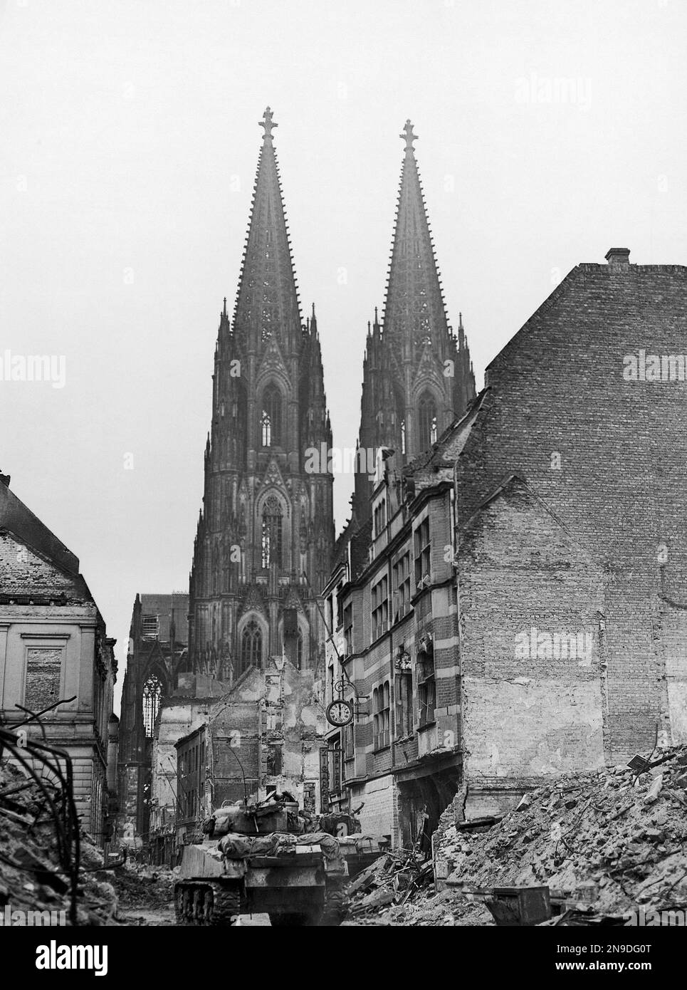 The historic cathedral of battered Cologne looms in the background, an ...
