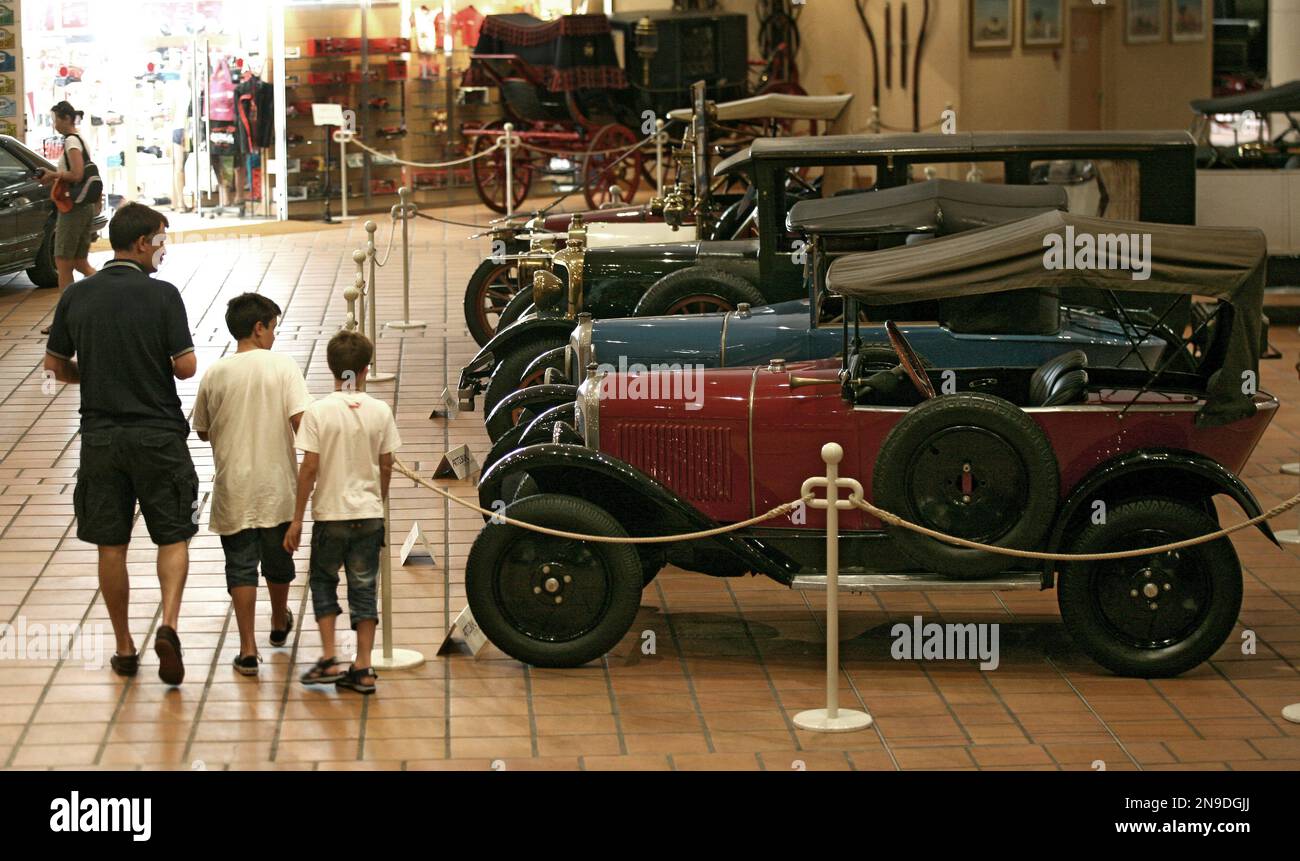 Visitors look at the cars of the collection of Prince Albert II of ...