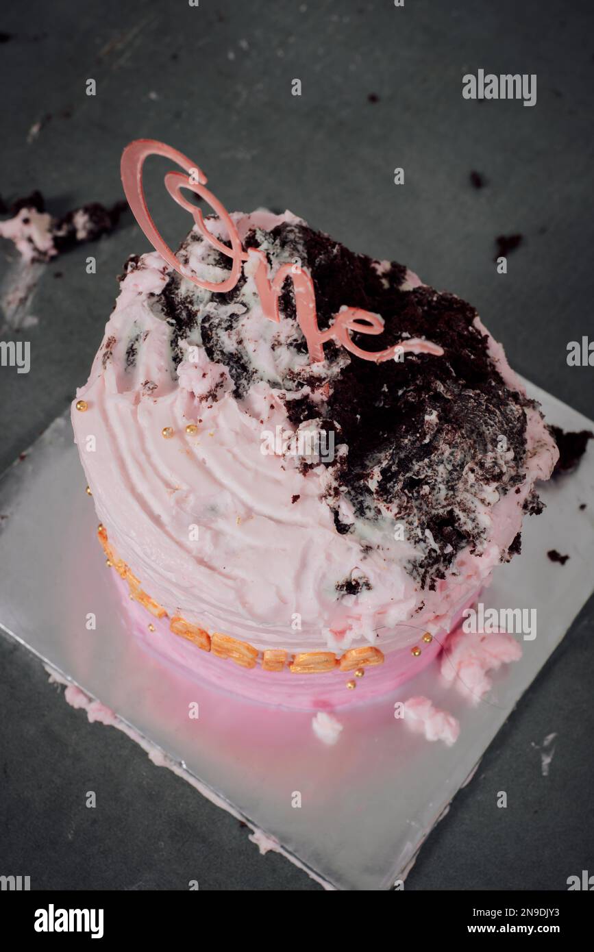 A pink smash cake with chocolate inside Stock Photo - Alamy