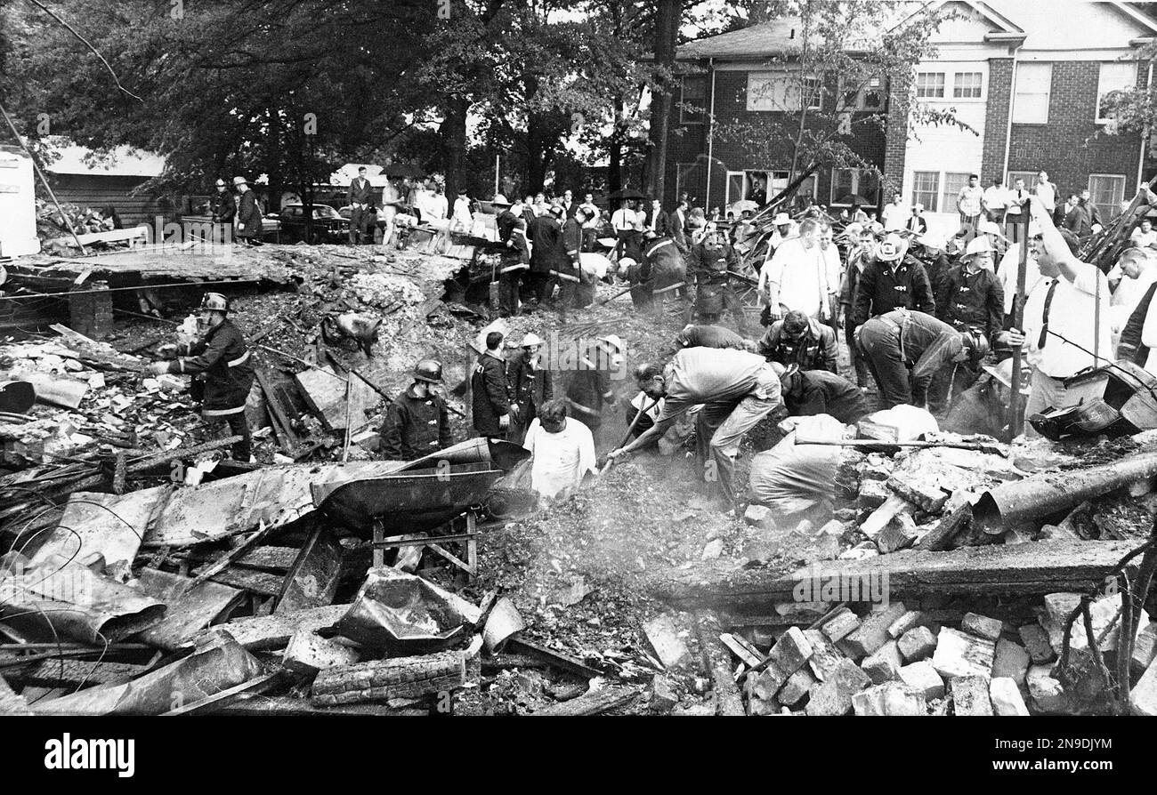 FILE - In this May 30, 1968 file photo, firefighters and volunteers dig ...