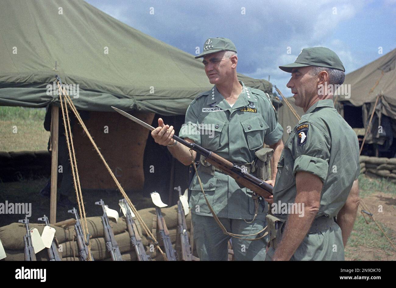General William C. Westmoreland examining rifles in Vietnam on June 7 ...