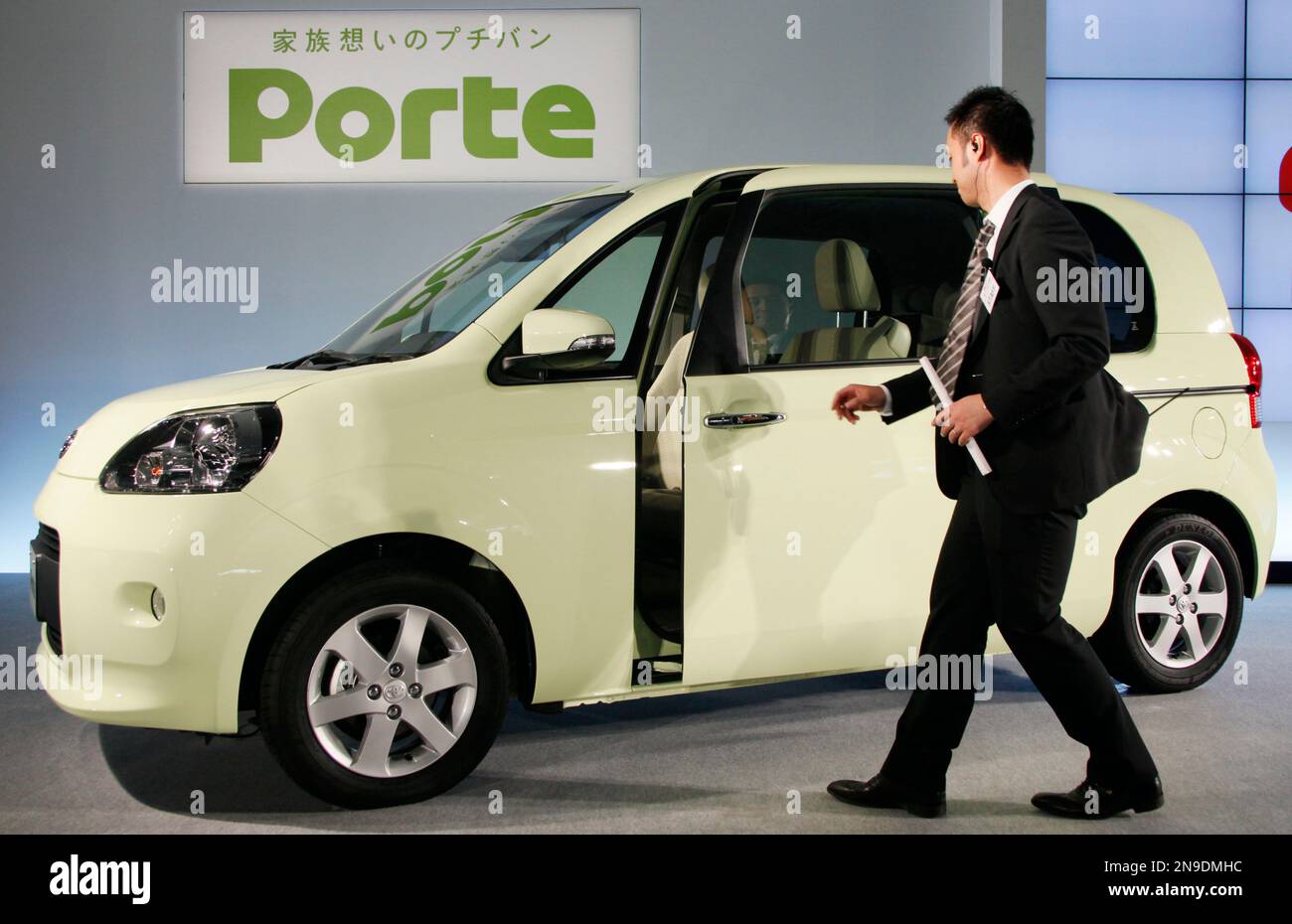 A man demonstrates how to open the sliding door of the fully remodeled ...