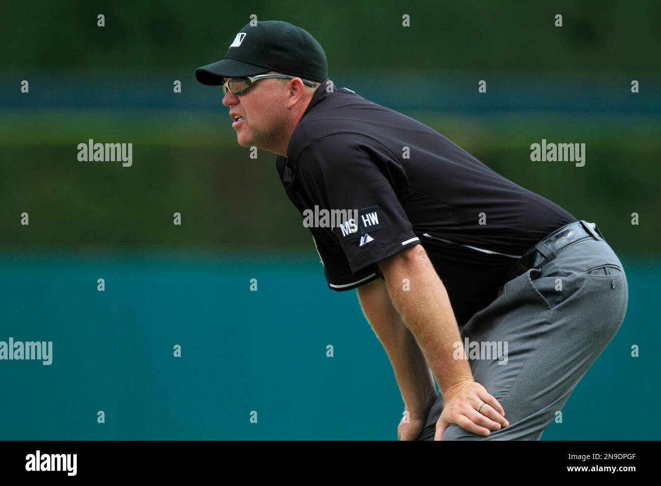 Umpire Ron Kulpa looks on from first base during the eighth inning of a ...