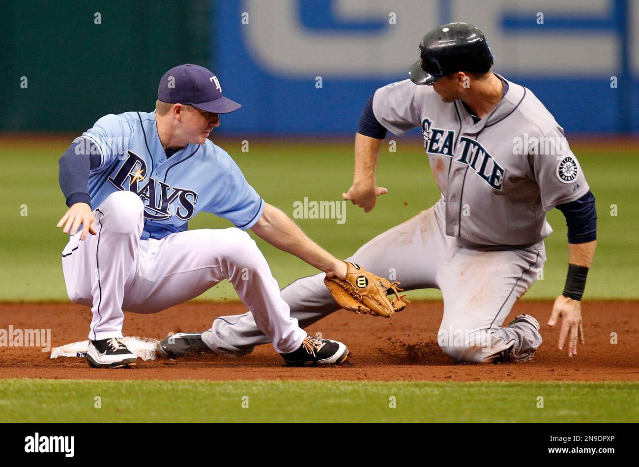 Seattle Mariners' Michael Saunders, left, steals second base ahead of a ...