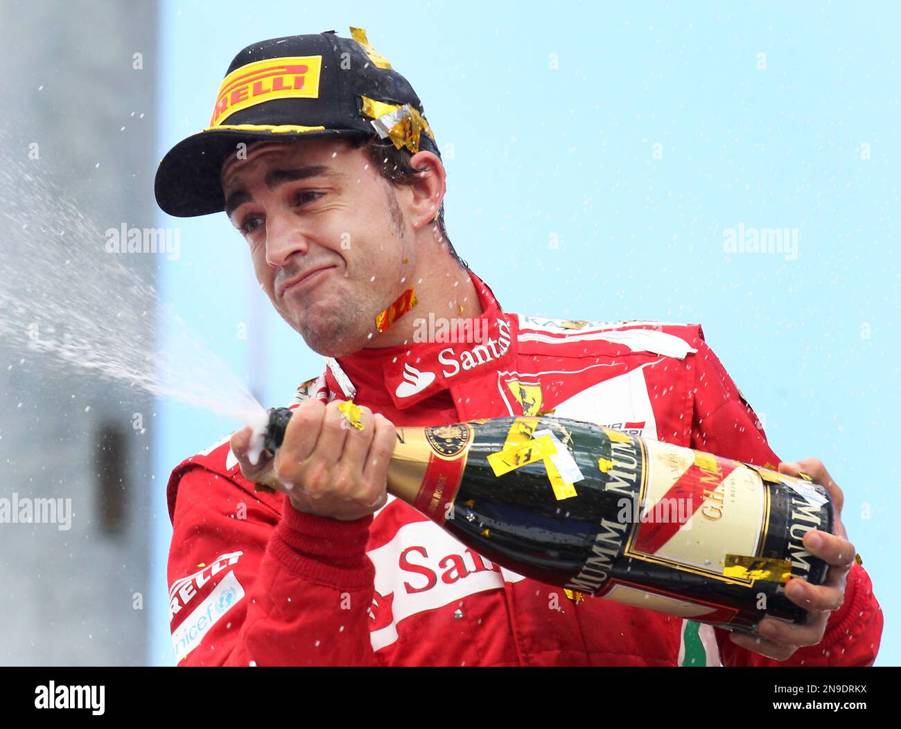 Spain's Ferrari driver Fernando Alonso sprays with champagne after ...