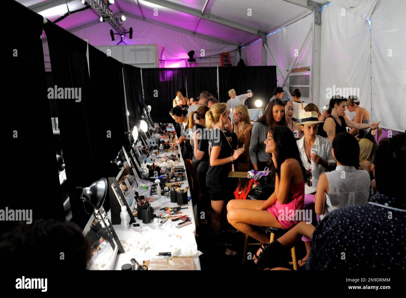 Models get ready backstage and have Hawaiian Tropic Silk Hydration ...