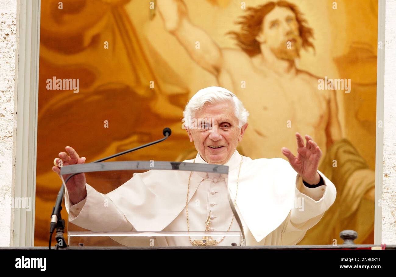 Pope Benedict XVI waves to faithful during the Angelus prayer at his ...
