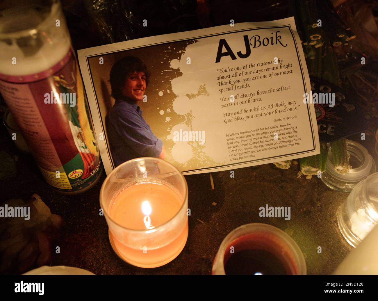 A photo and tribute to movie theater shooting victim AJ Boik is shown ...