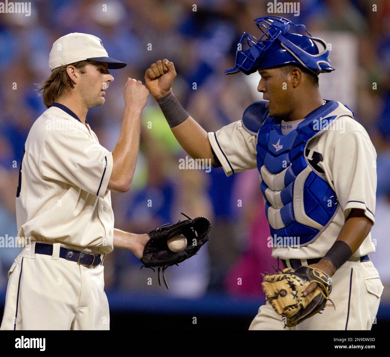 Kansas City Royals relief pitcher Aaron Crow, left, is congratulated by ...