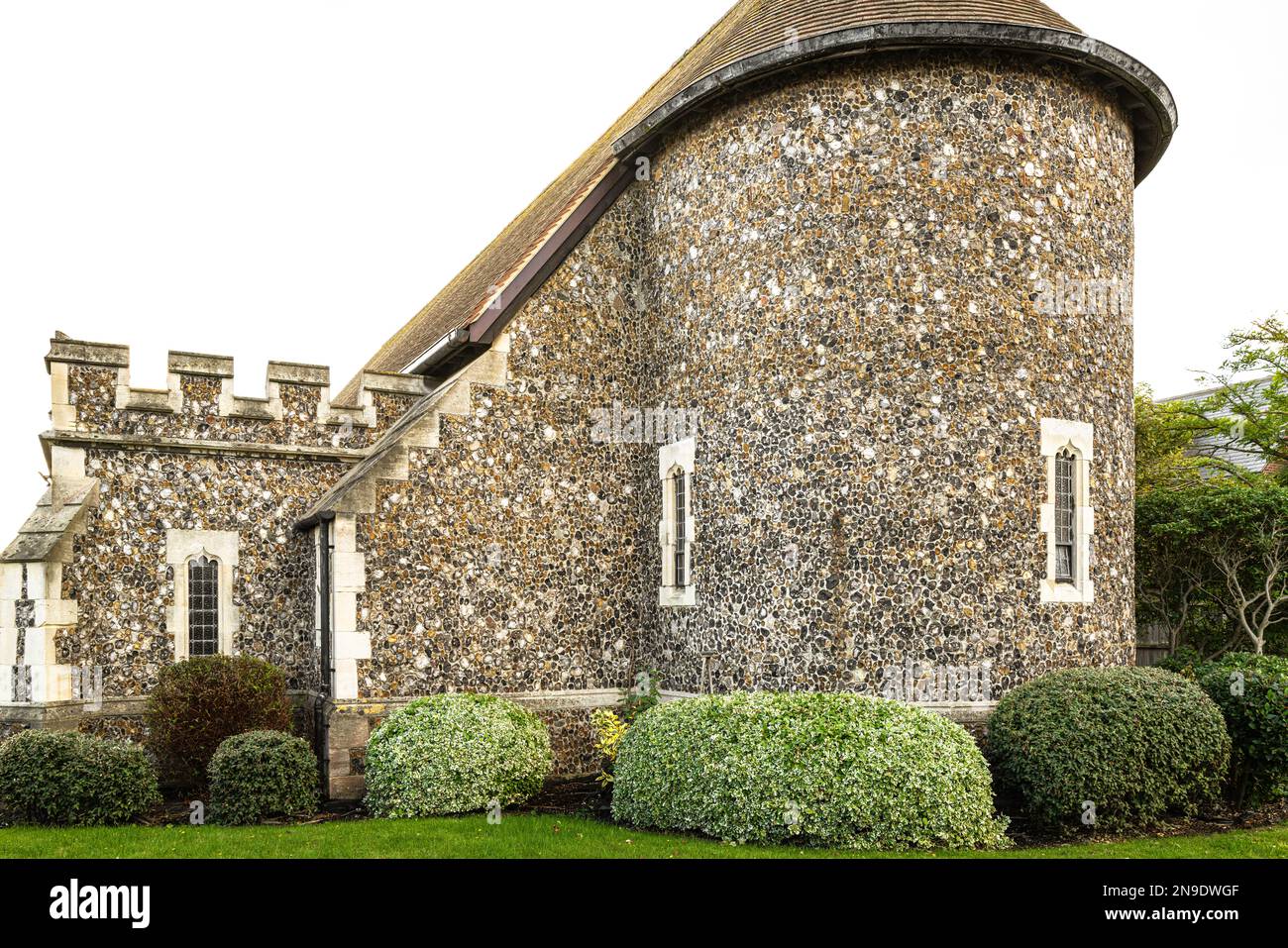 Unsual stone and flint built church showing the conical architecture of ...
