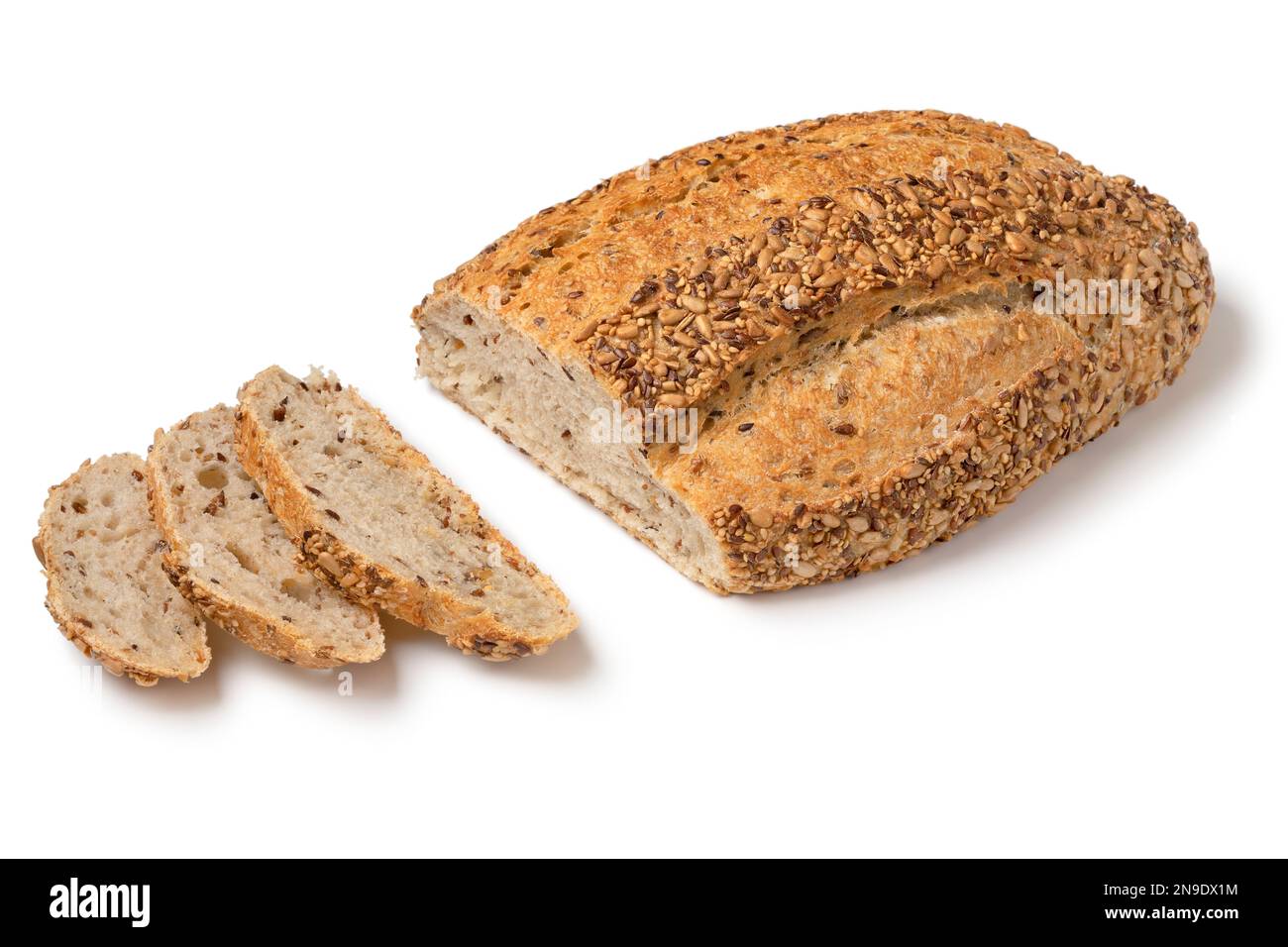 Fresh loaf and slices of country bread pain de campagne, and seeds ...