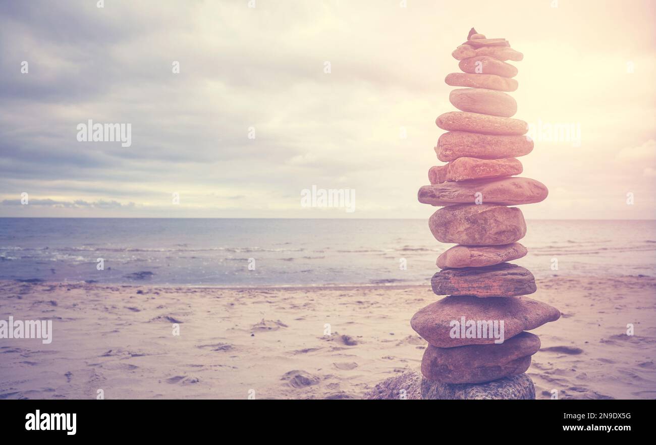 Stone stack pyramid on a beach, zen, harmony and balance concept, color ...