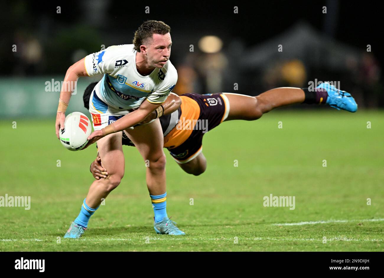 Thomas Weaver (left) of the Titans is tackled by Deine Mariner (right ...