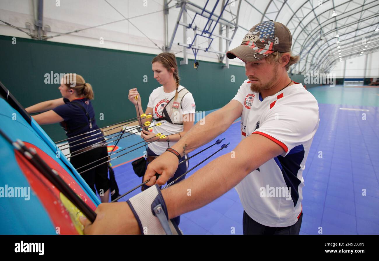 U.S. Olympic archer Brady Ellison, right, Jennifer Nichols, center, and ...