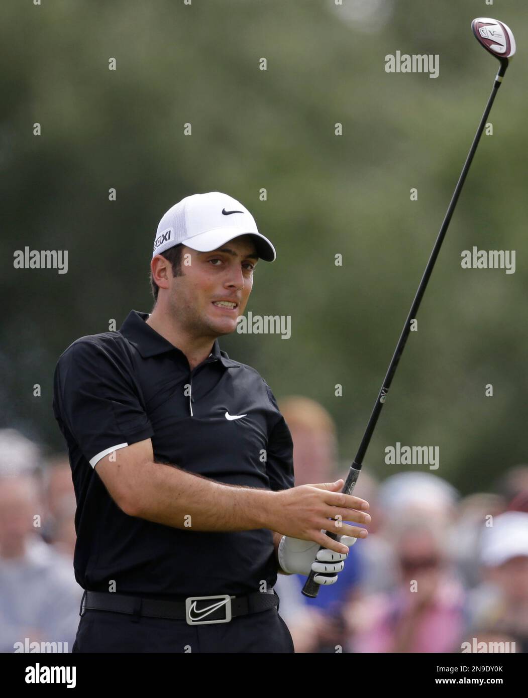 Francesco Molinari of Italy reacts after his shot off the fourth tee at ...