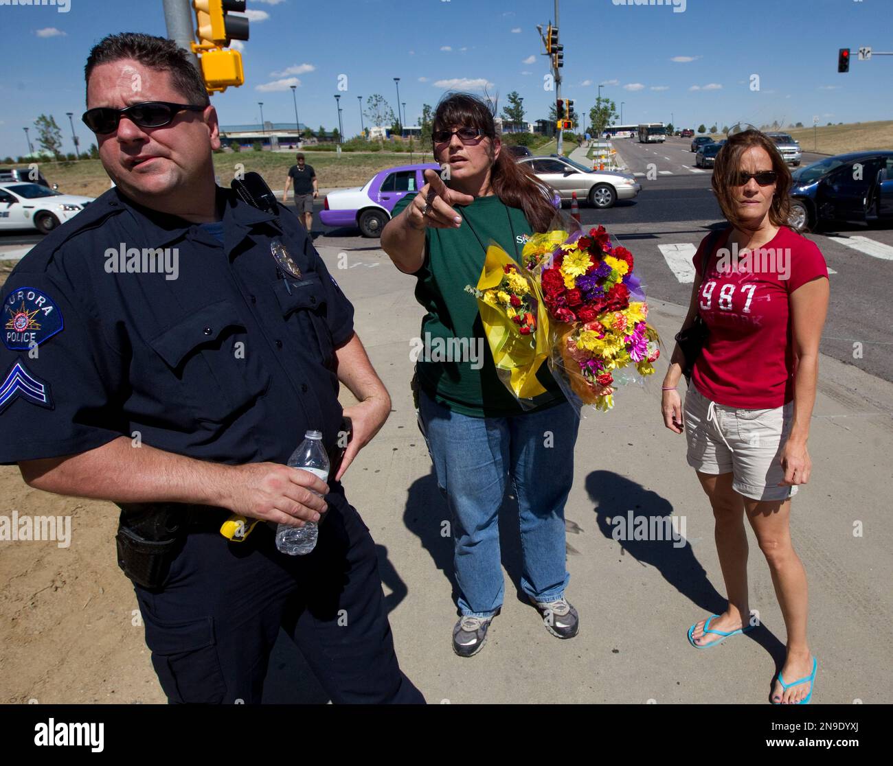 Tonya Goodman, center, and her friend Terry Morales, right, talk with ...