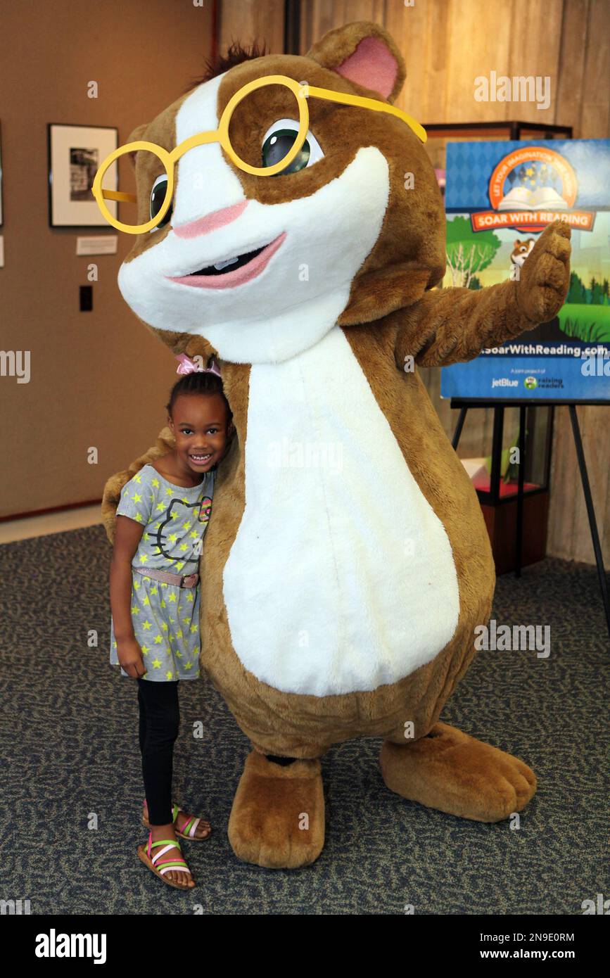 PBS KIDS mascot Hooper poses with a child during the Soar with Reading ...