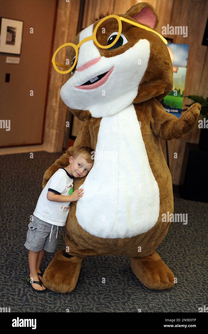 PBS KIDS mascot Hooper poses with a child during the Soar with Reading ...