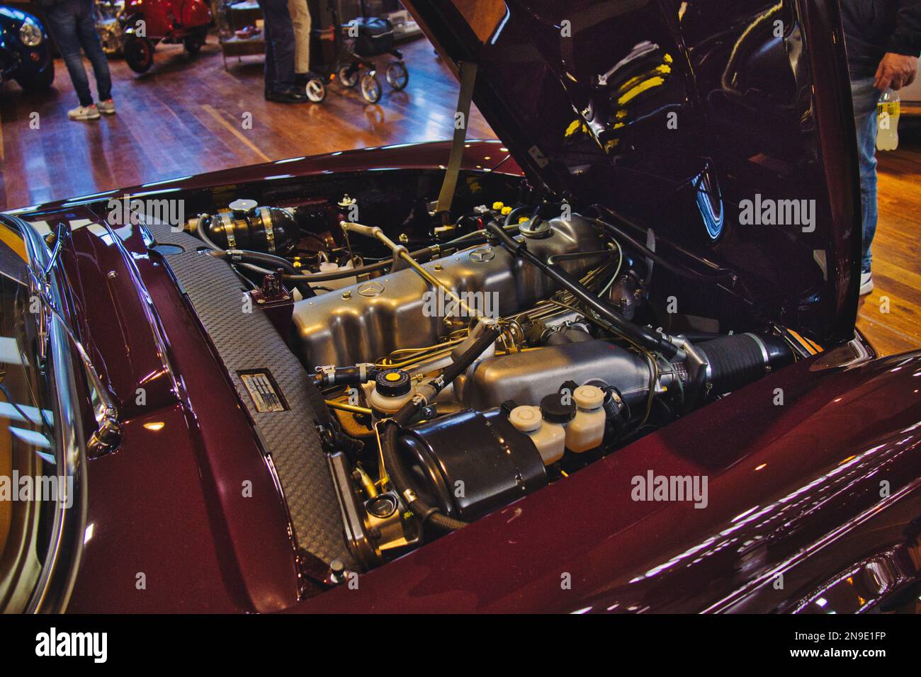 A close-up of an engine of a red Mercedes-Benz W113 car Stock Photo - Alamy