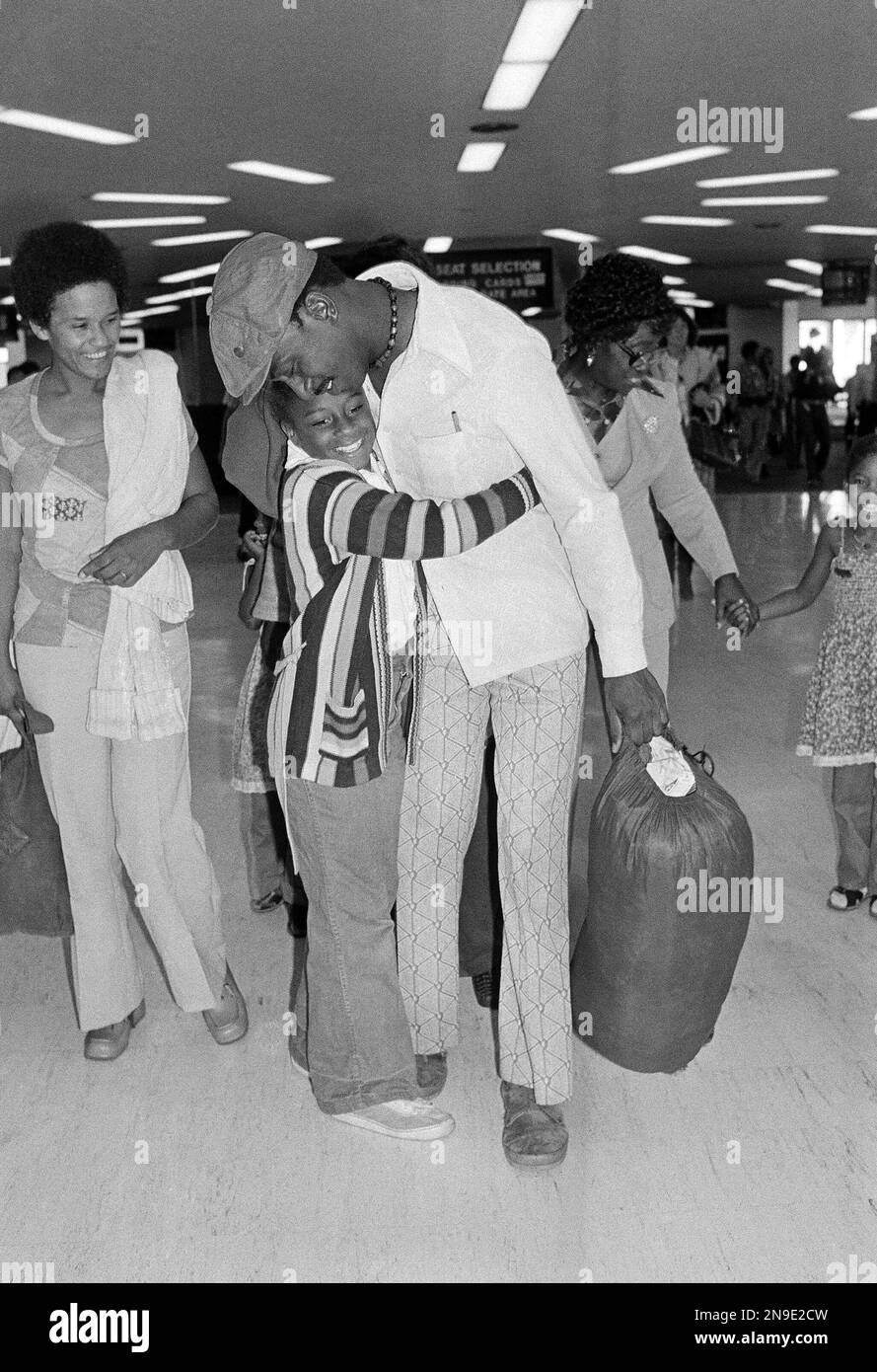 Michelle Rachelle, 10, hugs her cousin Julius Evans after he arrived ...
