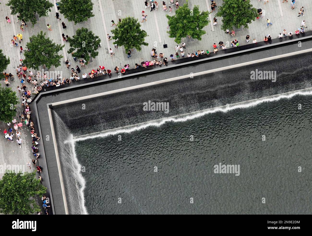 In this photo of July 19, 2012, people visit the memorial waterfall of ...