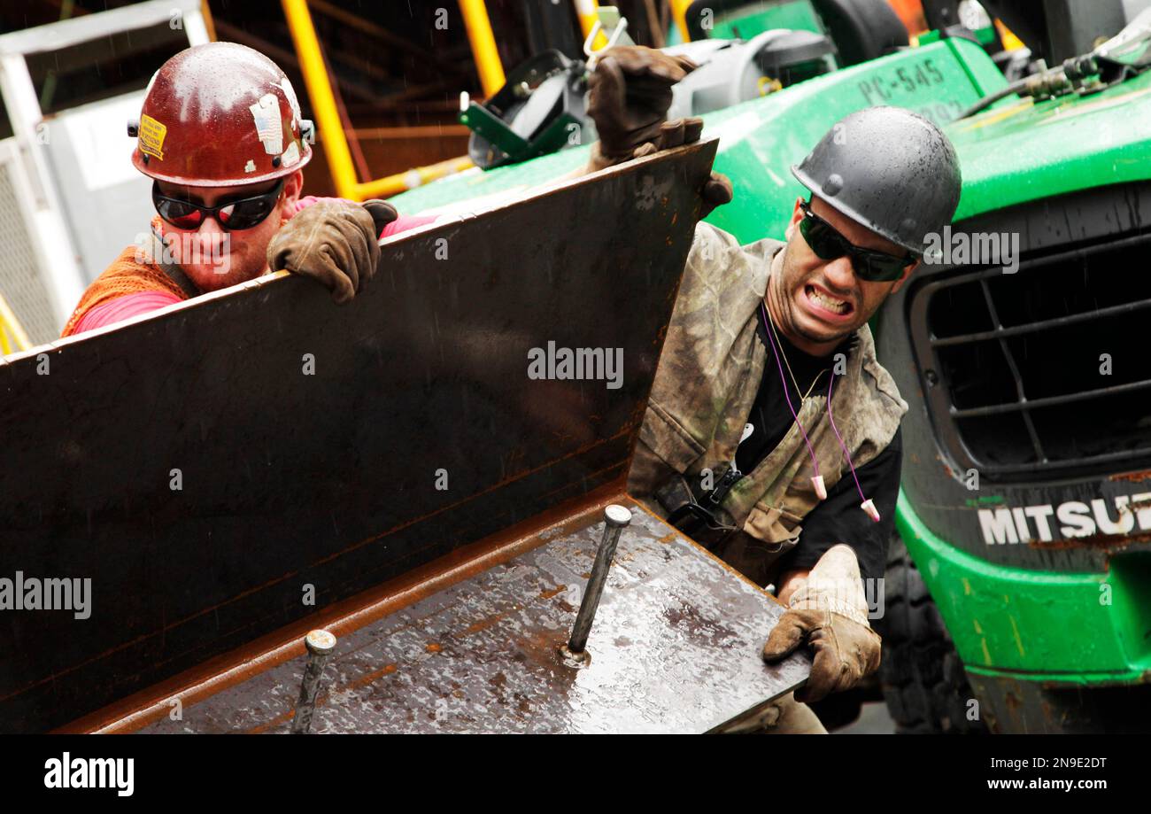 In this photo of July 19, 2012, construction workers move a piece of ...
