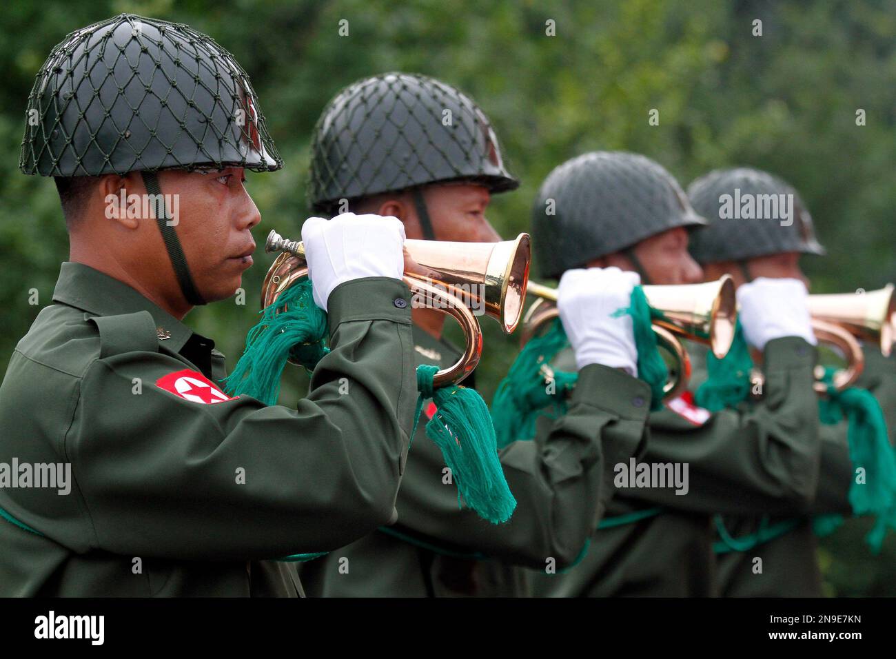Myanmar soldiers play during a ceremony to mark the 65th anniversary of ...