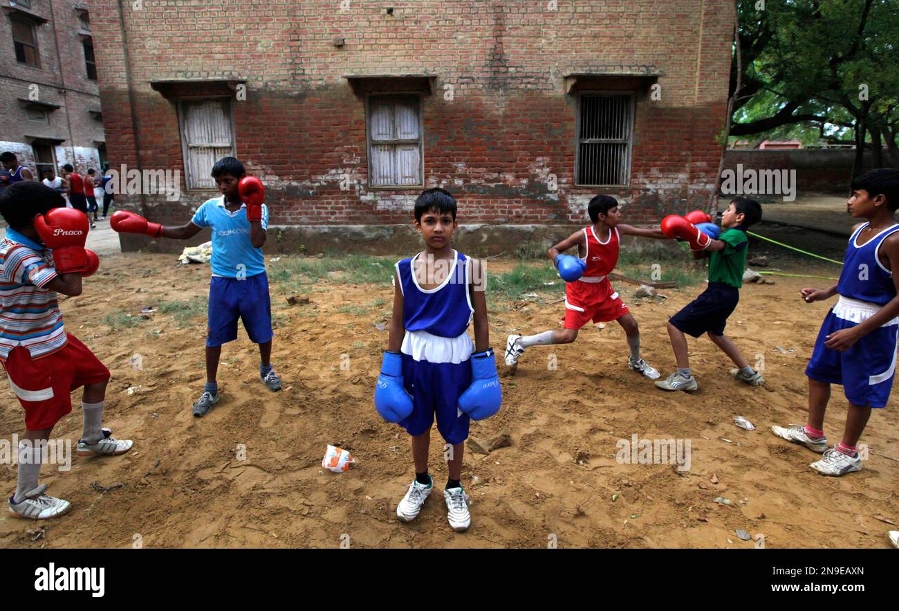 In this Thursday, July 12, 2012, photo, Indian young trainees practice ...