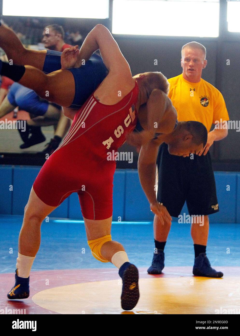 Army Capt. John Anderson, right, looks on as Jack Jensen (red) and Pete ...