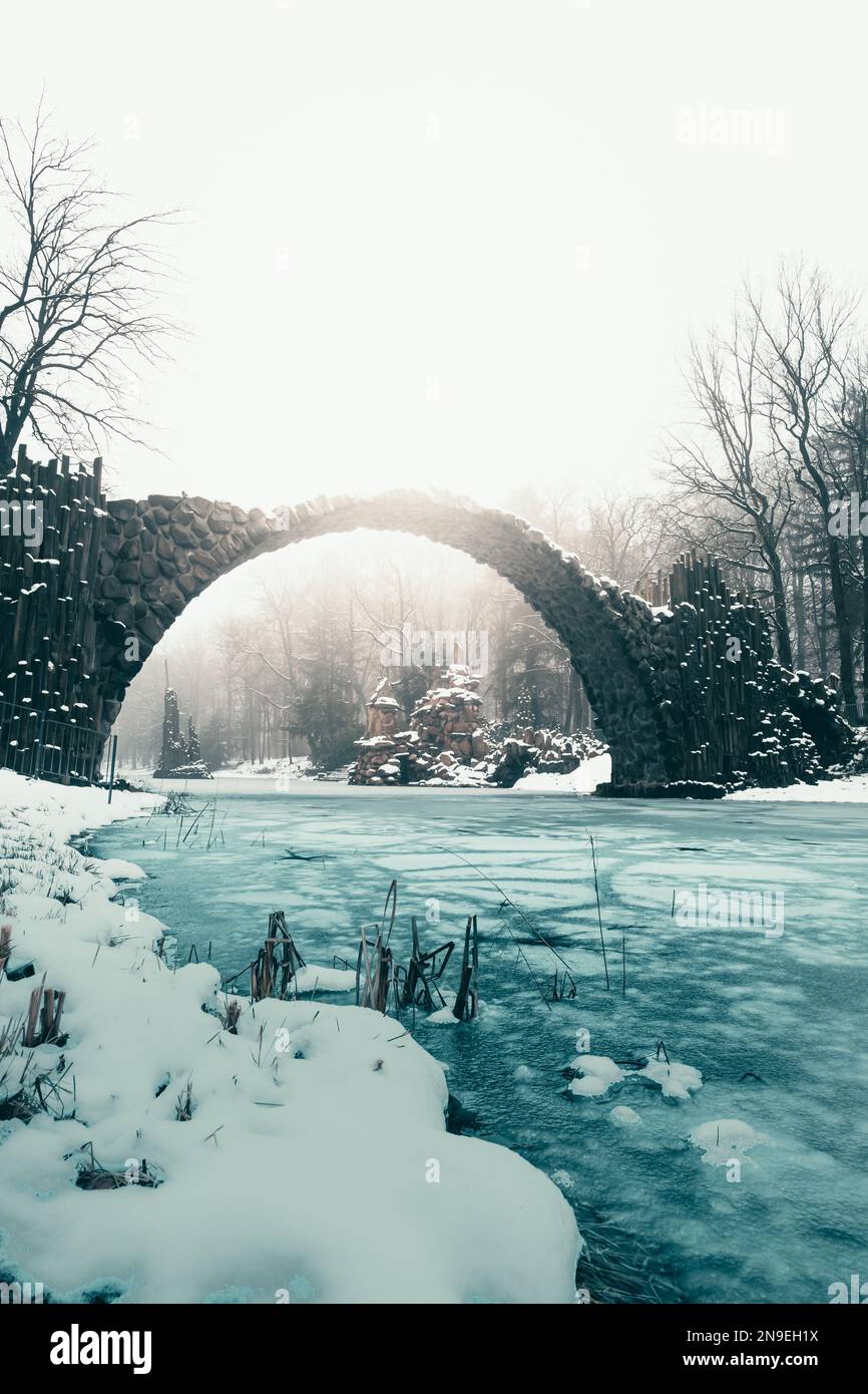 Middle Earth in Winter: An Old Stone Bridge over a Frozen Lake Stock ...
