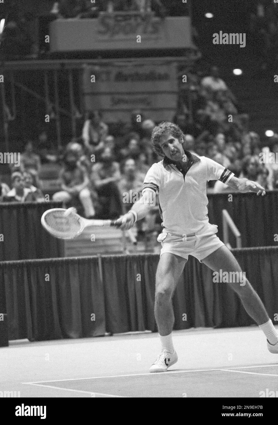 American tennis player Brian Gottfried contorts his forehand and his ...