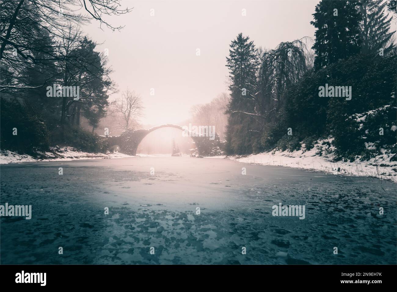 Middle Earth in Winter: An Old Stone Bridge over a Frozen Lake Stock ...