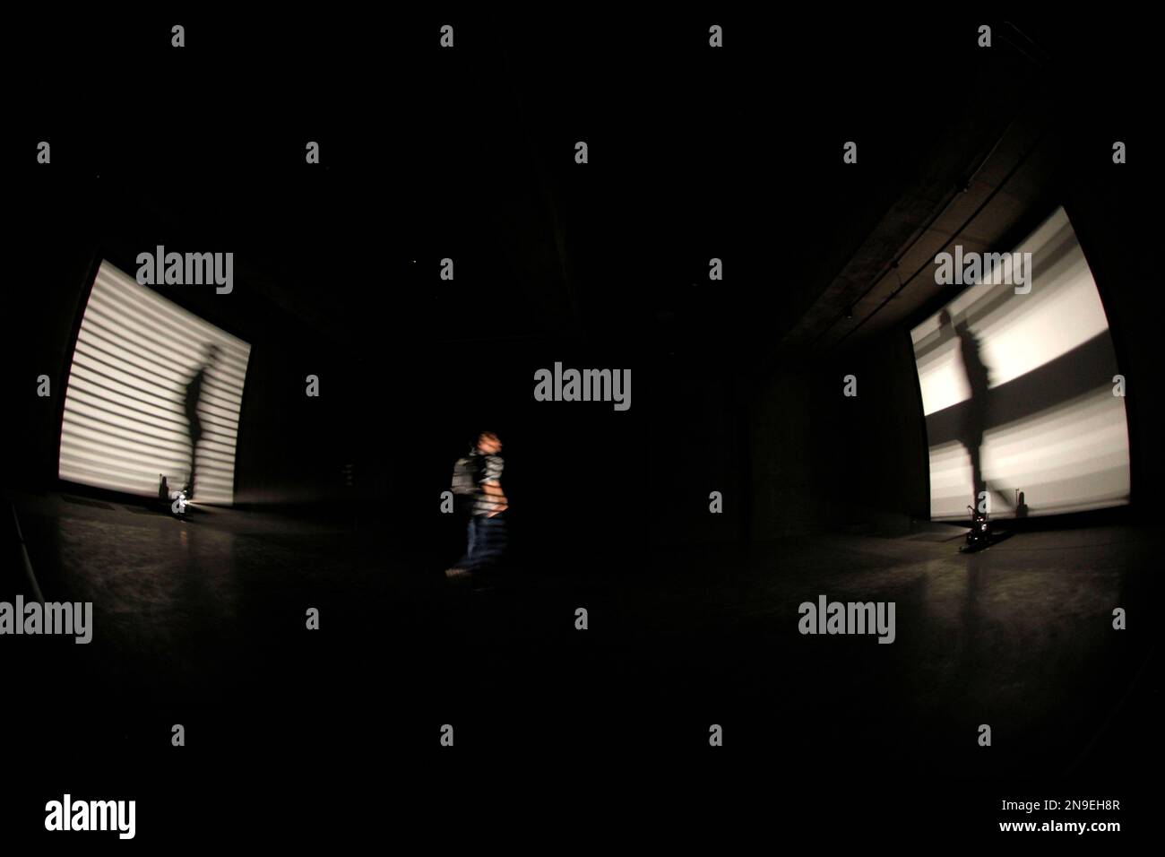 In this photo taken with a fisheye lens, a visitor walks through an ...