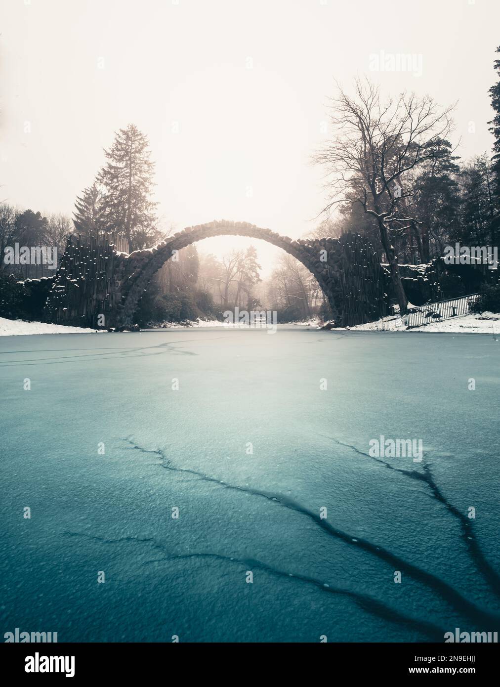 Middle Earth in Winter: An Old Stone Bridge over a Frozen Lake Stock ...
