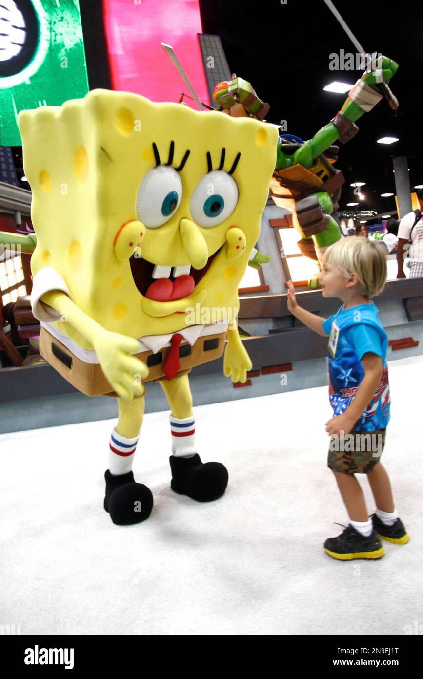COMMERCIAL IMAGE - A fan is seen with SpongeBob SquarePants during ...
