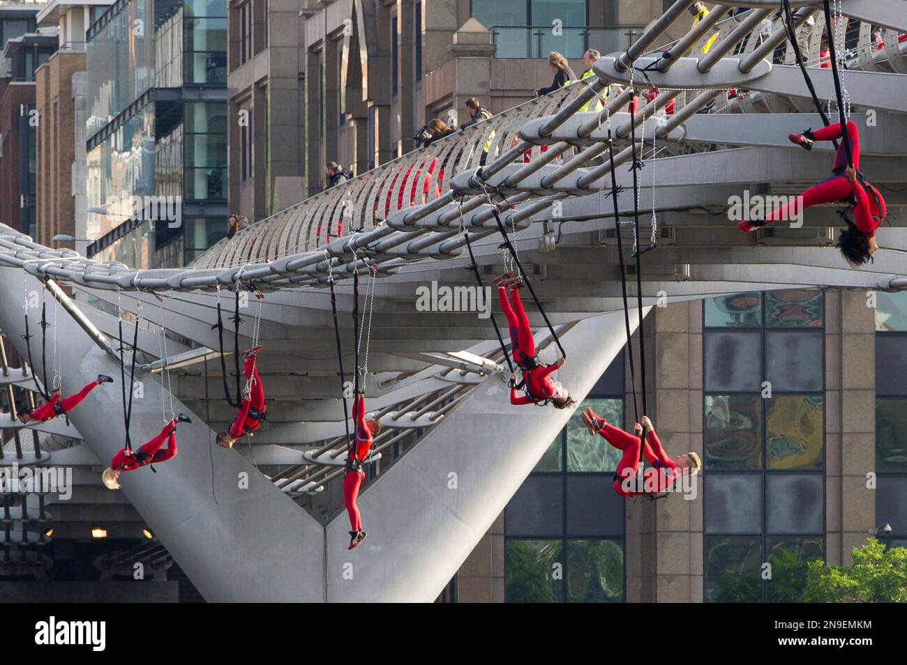 Artists using trapezes and bungee ropes from performance company STREB ...