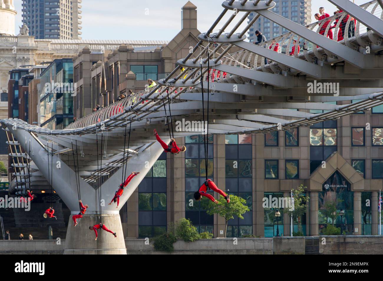 Artists using trapezes and bungee ropes from performance company STREB ...