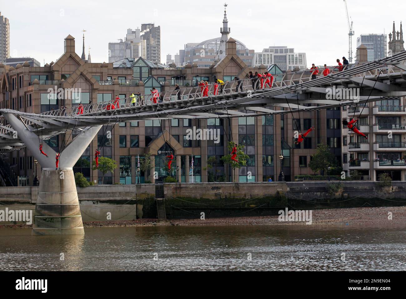 "Extreme dancers" perform, hanging from the Millennium Bridge in London ...