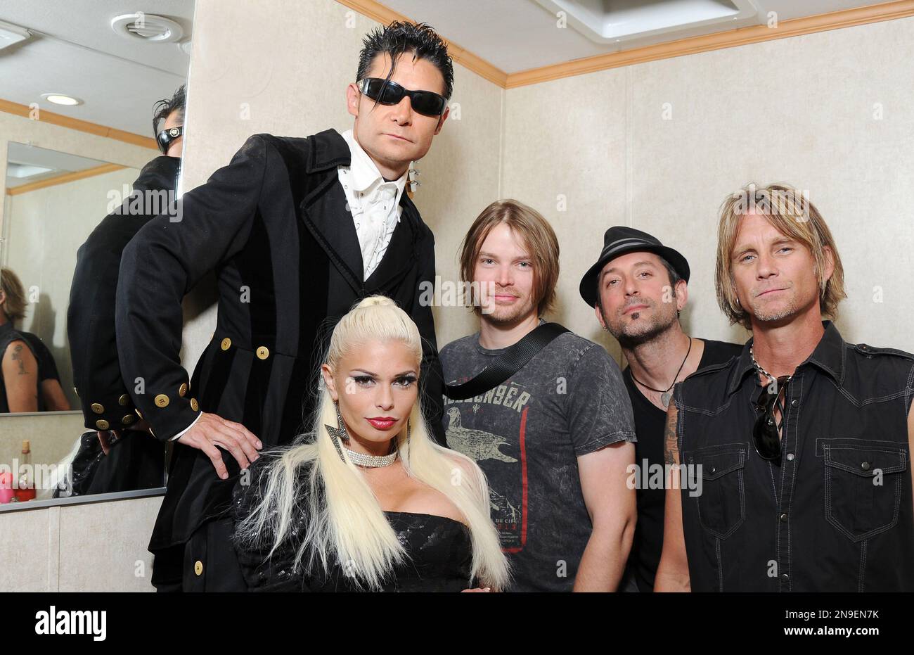 Corey Feldman, at left, and his band, The Truth Movement, pose for a ...