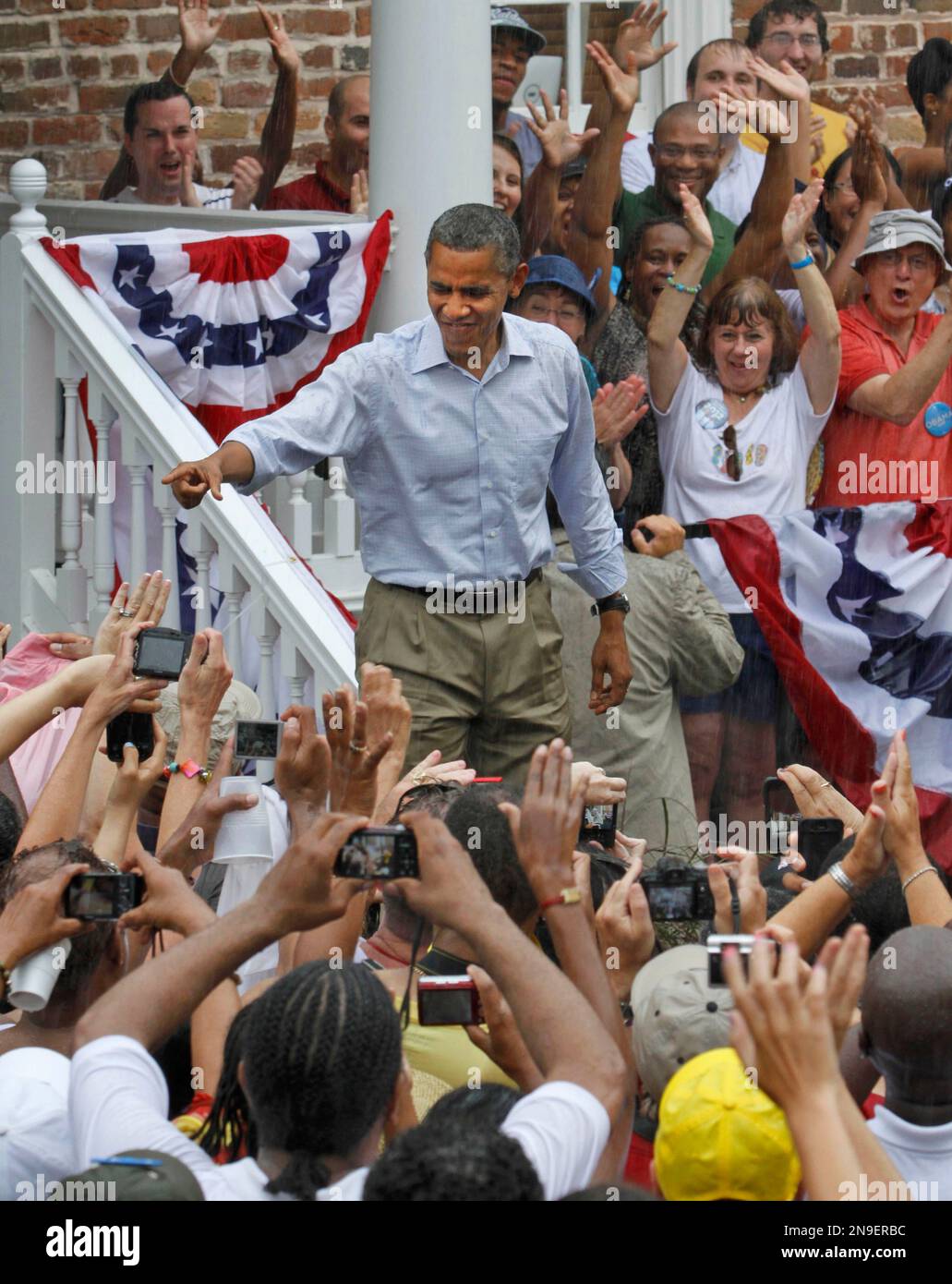 President Barack Obama waves to the crowd as he arrives at a re ...