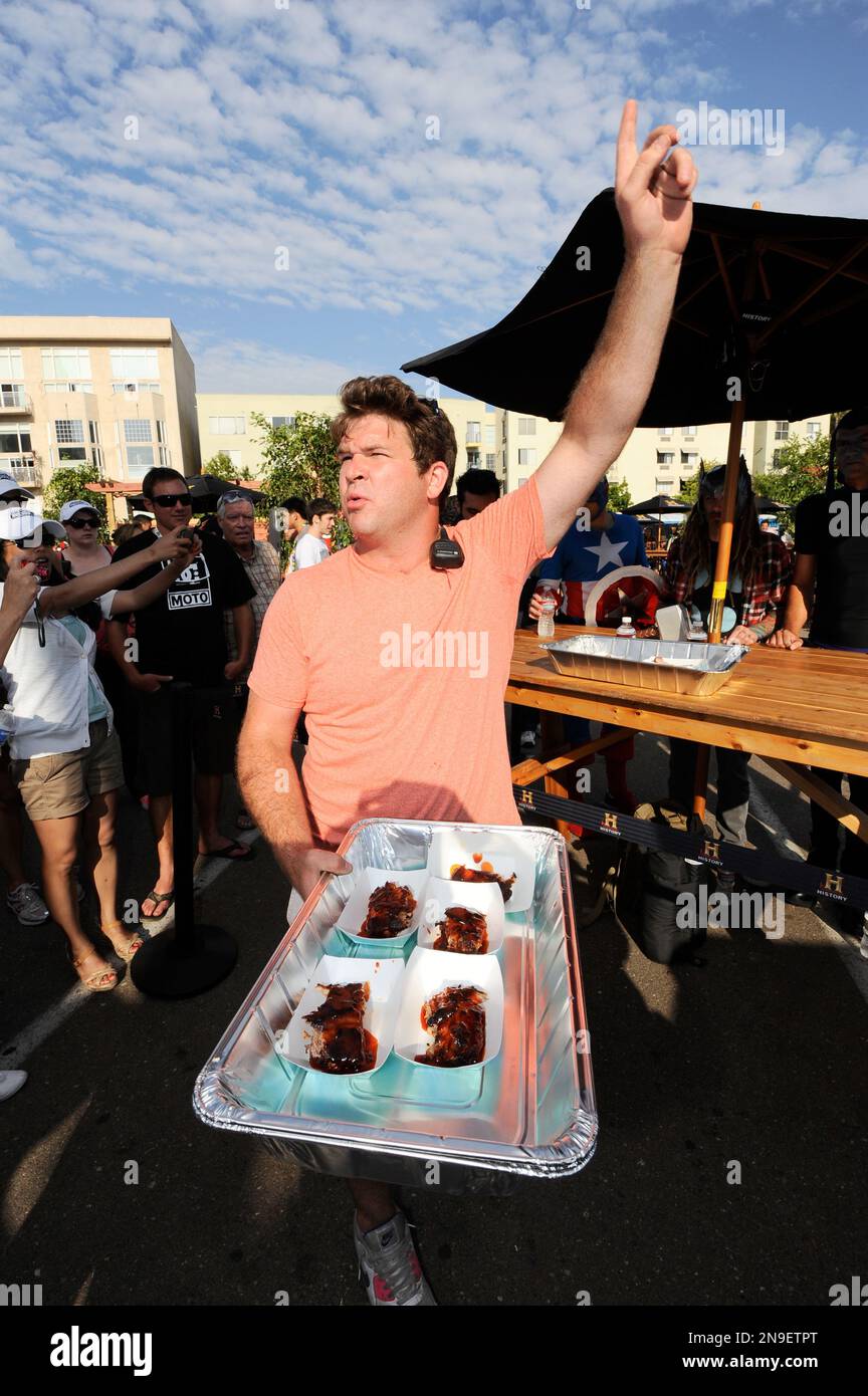 Ben Turk serves up ribs at the HISTORY Cross-Country Cookout at Comic ...