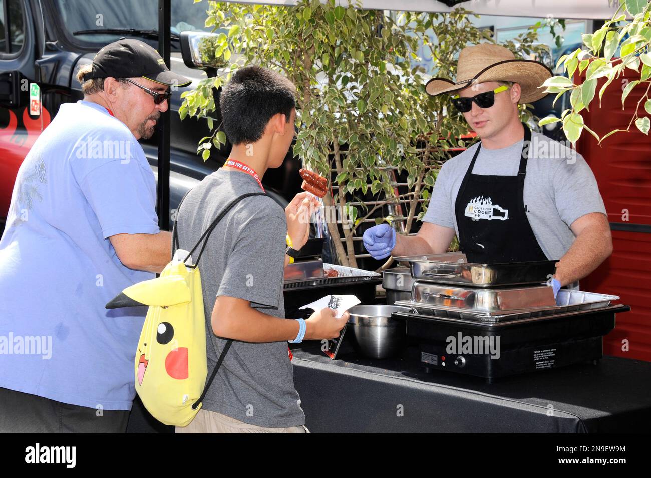 Bryce Wark, right, serves up HISTORY hickory sausage at the HISTORY ...