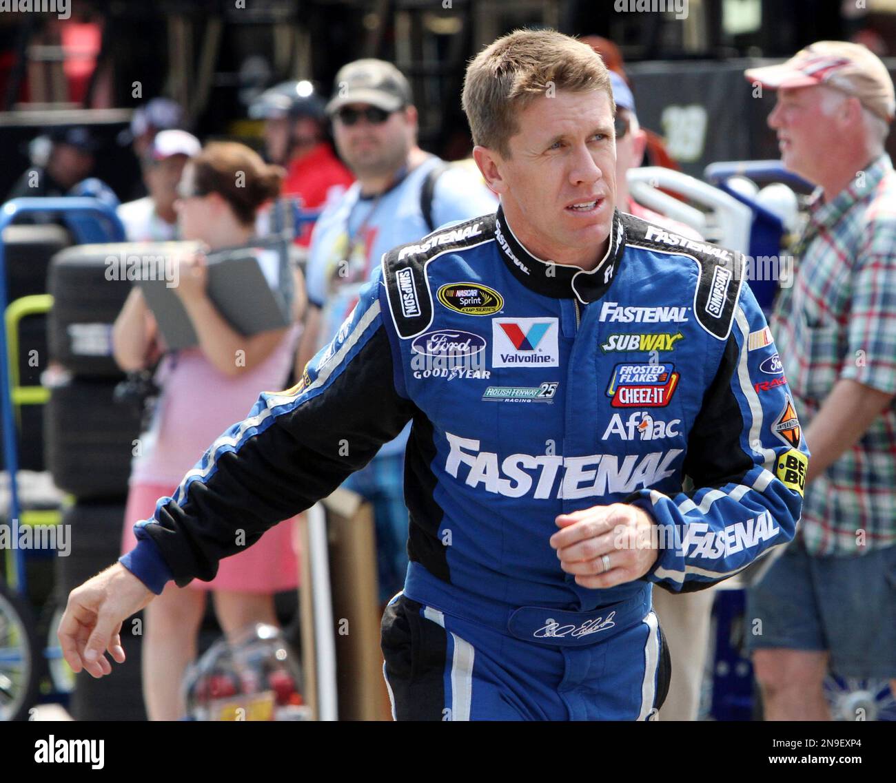 NASCAR driver Carl Edwards runs through the garage area before practice ...