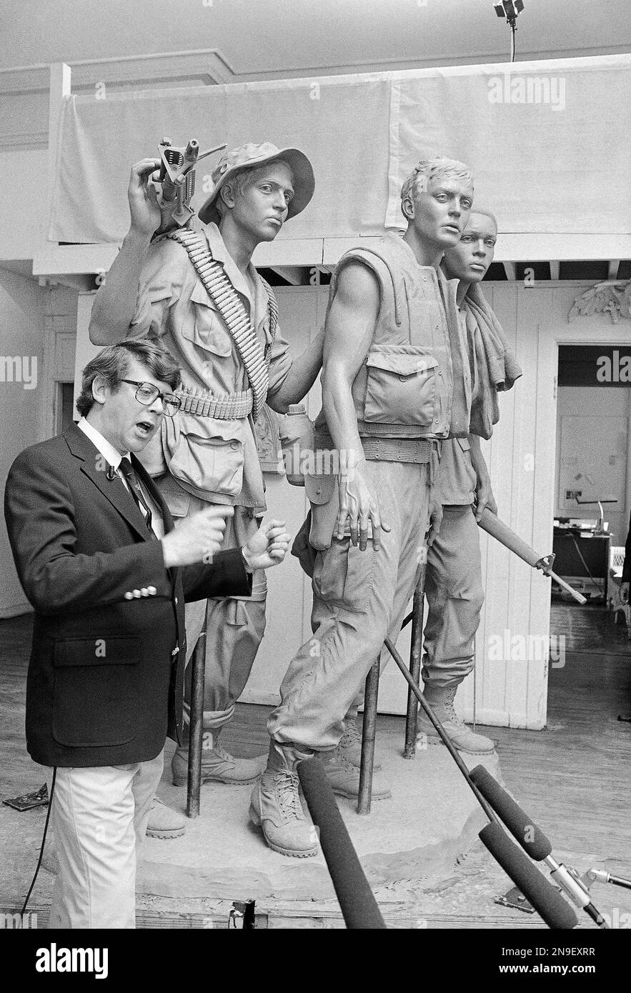Sculptor Fredrick Hart gestures while standing in front of the ...