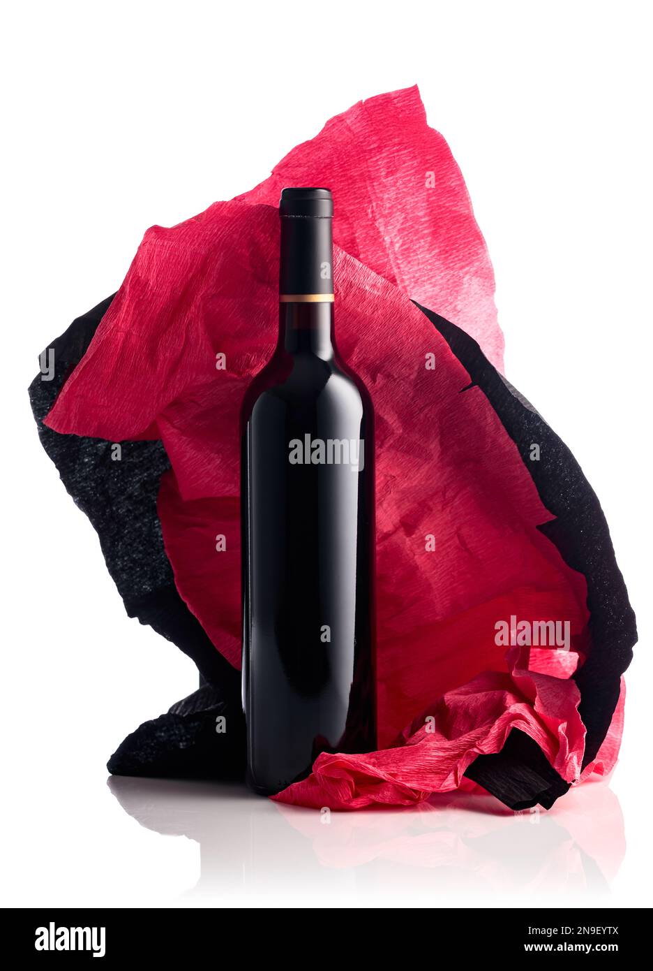 Bottle of red wine with crumpled red and black crepe paper isolated on ...