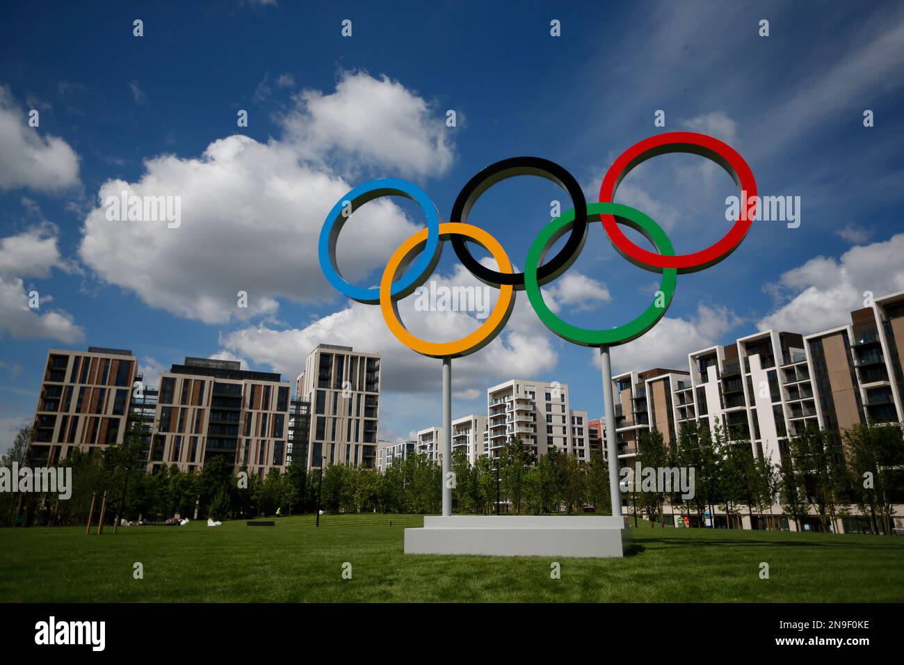 Olympic rings are seen backdropped by athletes' accommodation buildings ...